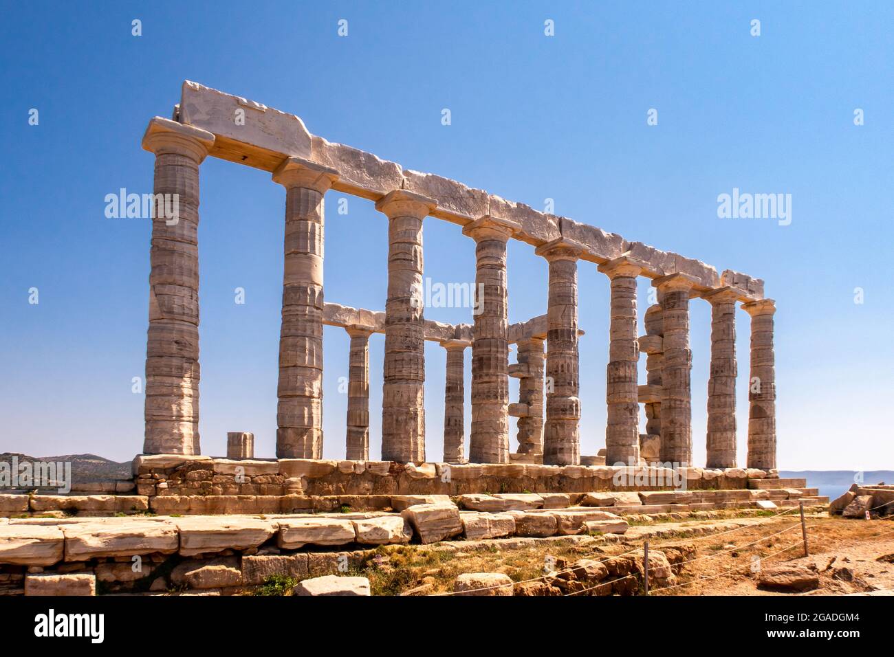 The ancient Greek Temple of Poseidon at Cape Sounion, doric columns and ...