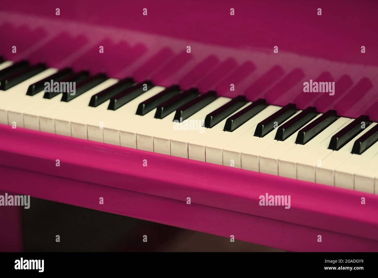 Piano keys of pink piano close up Stock Photo - Alamy