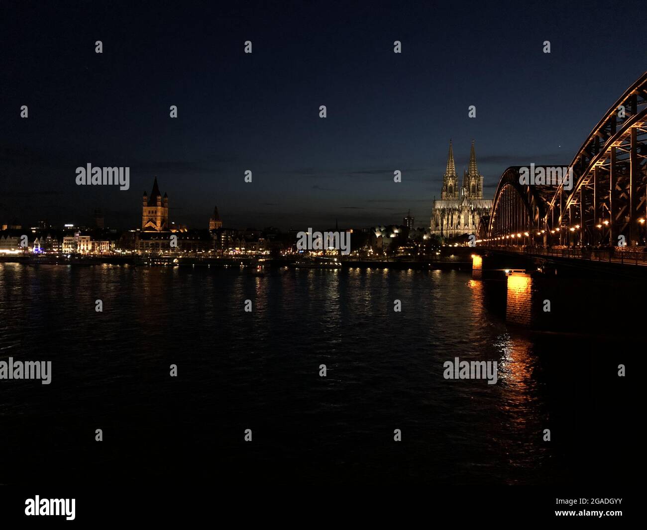 Beautiful Cologne Cathedral at night near river Rhine and Hohenzollern ...