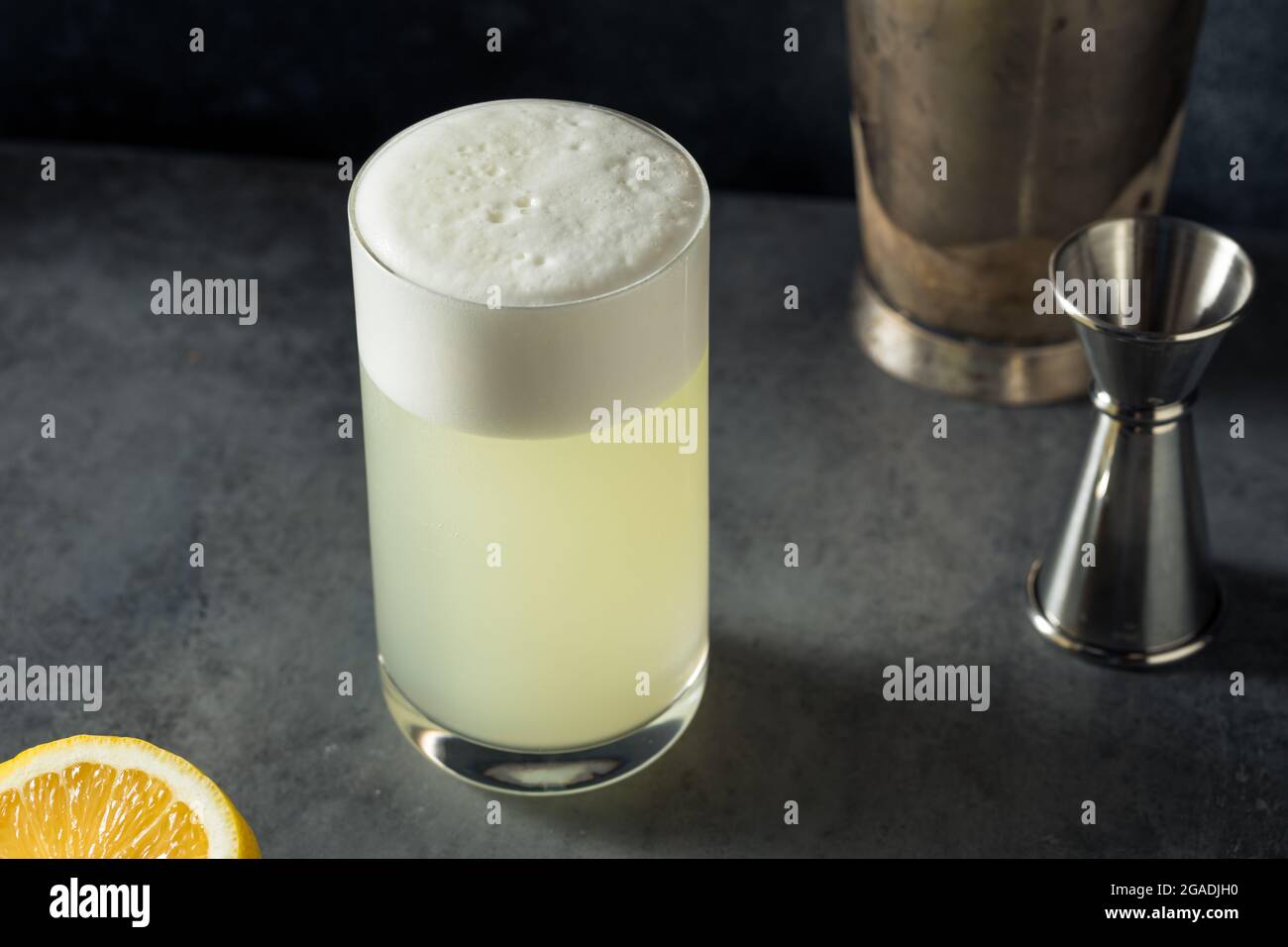 Boozy Refreshing Lemon Gin Fizz with an Egg White Stock Photo - Alamy
