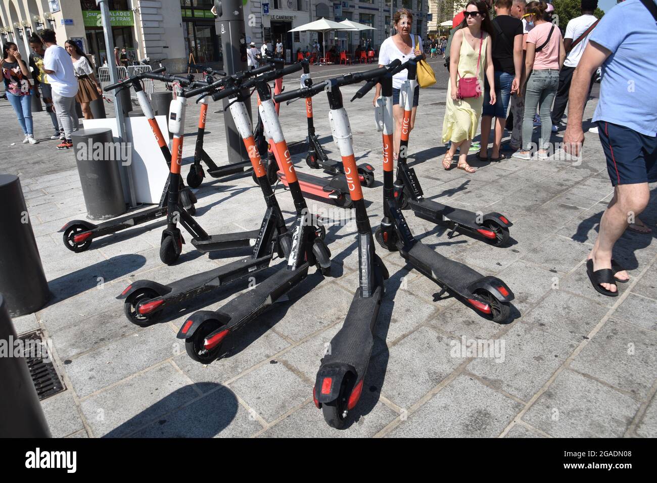 July 10, 2021, Marseille, France: People seen walking past electric scooters on La Canebiere in ...