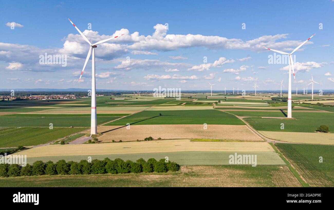 Large agricultural field with turning wind turbines Stock Photo - Alamy