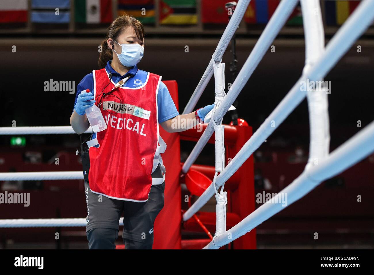 Tokyo, Japan. 30th July, 2021. A staff member disinfects the boxing ...