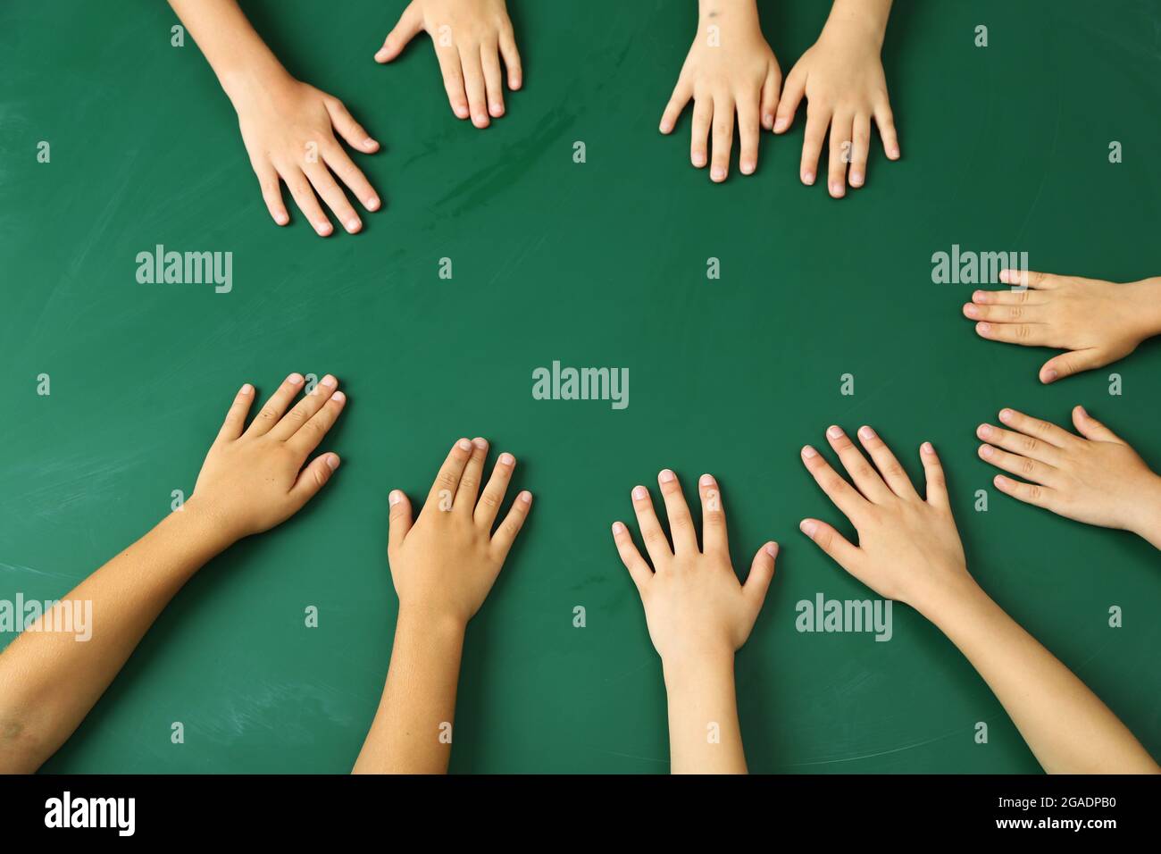 Children hands on blackboard background Stock Photo - Alamy