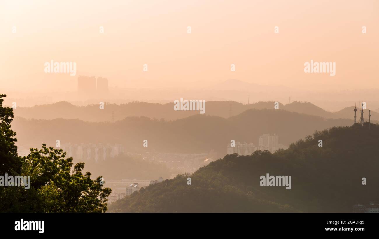 Smog in big city, air pollution in city environment Stock Photo - Alamy