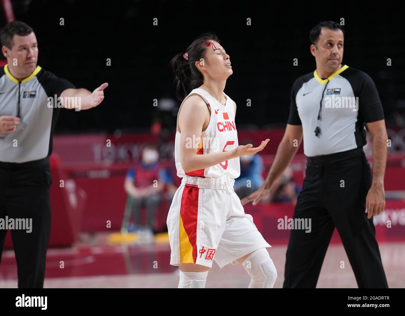 Saitama, Japan. 30th July, 2021. Wang Siyu (C) of China gets injured ...