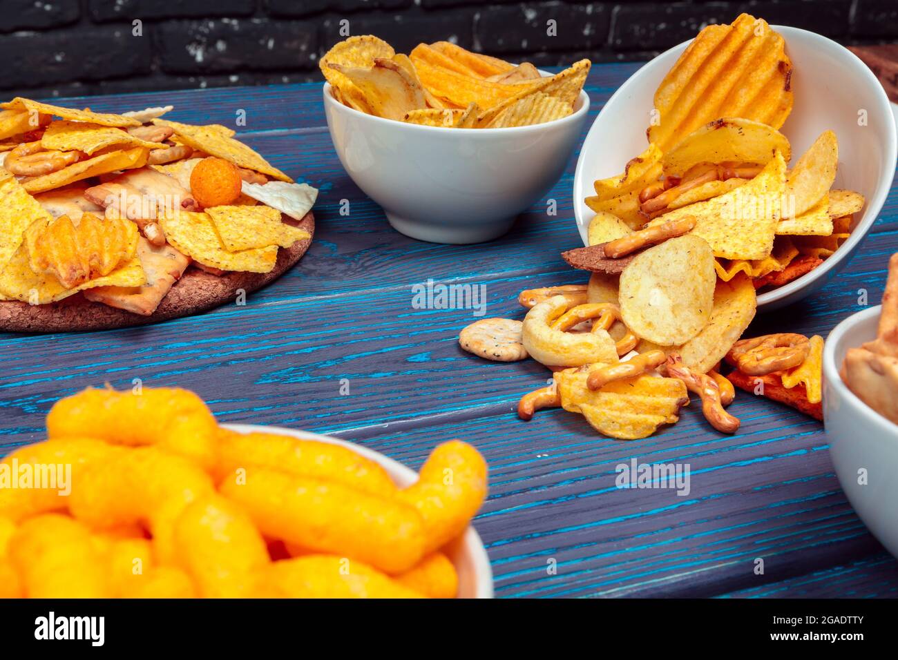 Differnt Types of Junk food, salty-sticks, salty-crackers on wooden ...