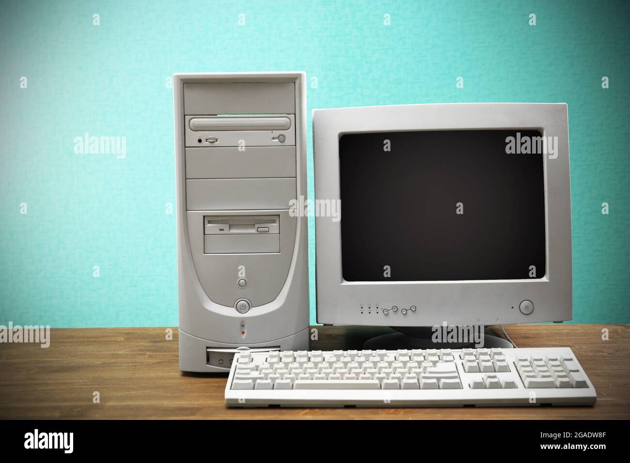 Obsolete computer set on light blue background Stock Photo - Alamy