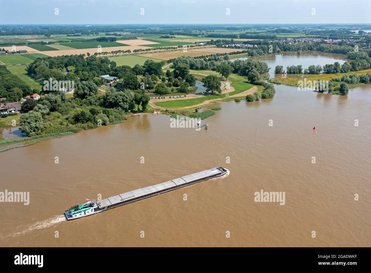 Aerial from a freighter cruising on the river Merwede in a flooded ...