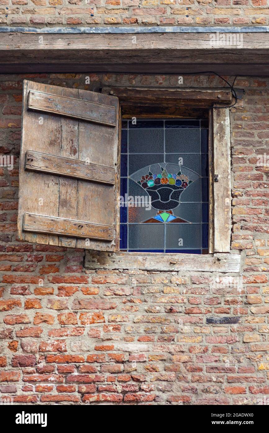 Stained glass window with wooden shutter, 's-Hertogenbosch, the ...