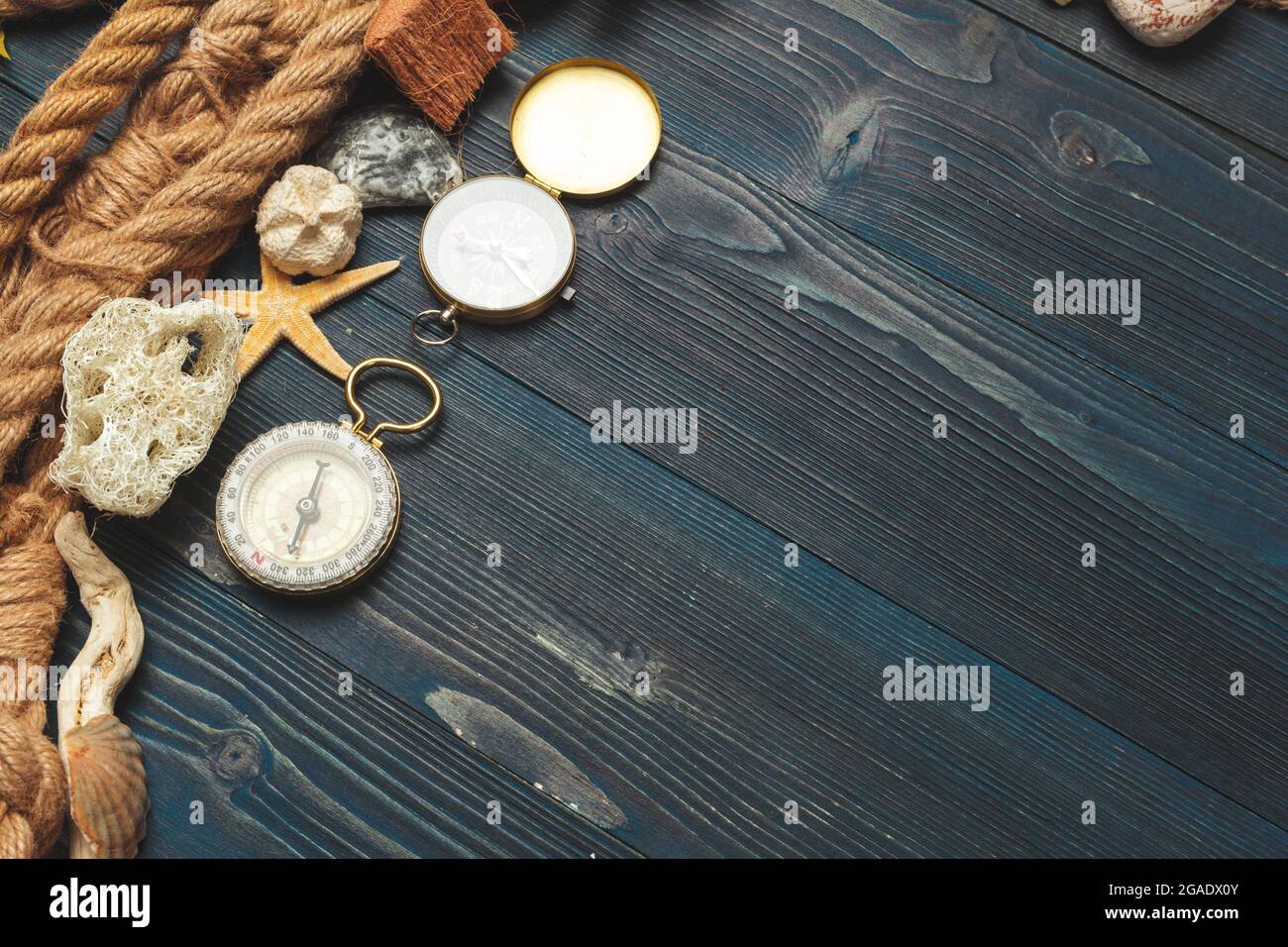Nautical background. Sailing rope with a compass Stock Photo - Alamy