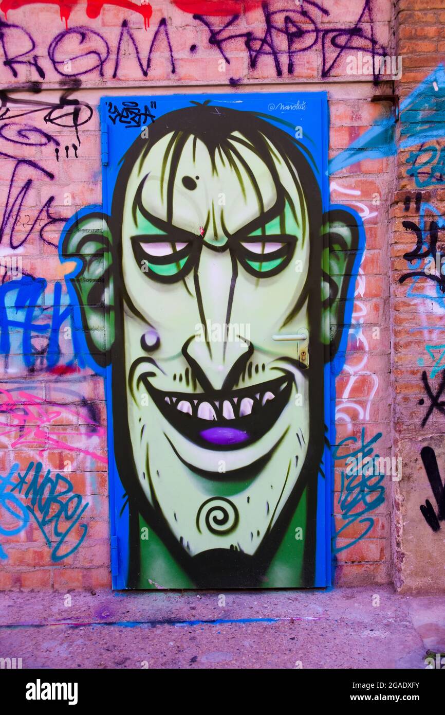 Street art. Portrait of a man in cartoon style. Graffiti on a wall ...