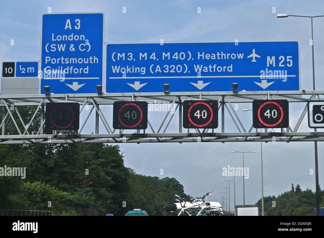 Motorway traffic and signage gantry Stock Photo - Alamy