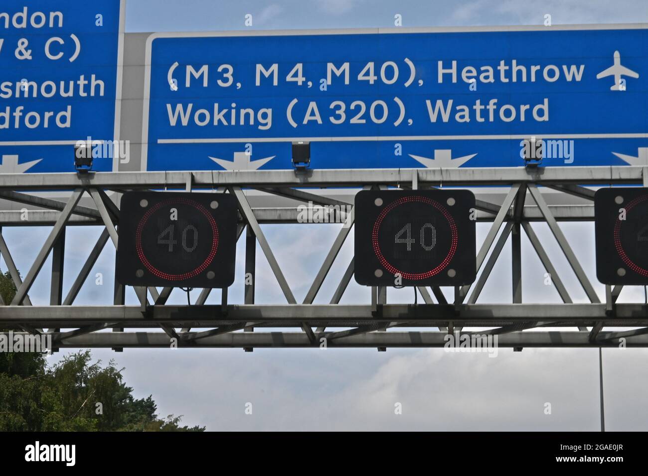 Motorway traffic and signage gantry Stock Photo - Alamy