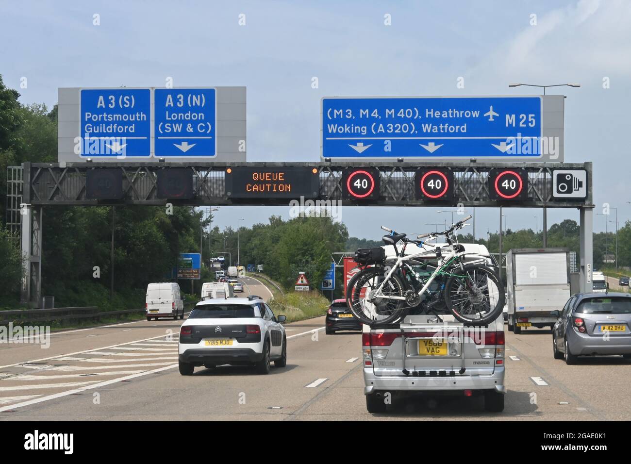 Motorway traffic and signage gantry Stock Photo - Alamy