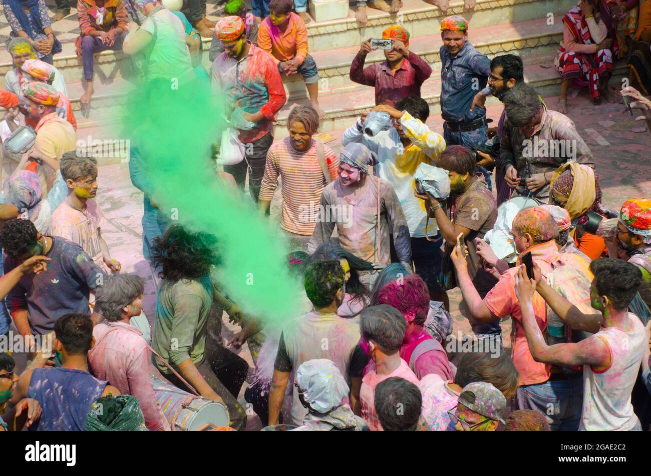 Green smoke of powder color is billowing in Holi festival in India ...