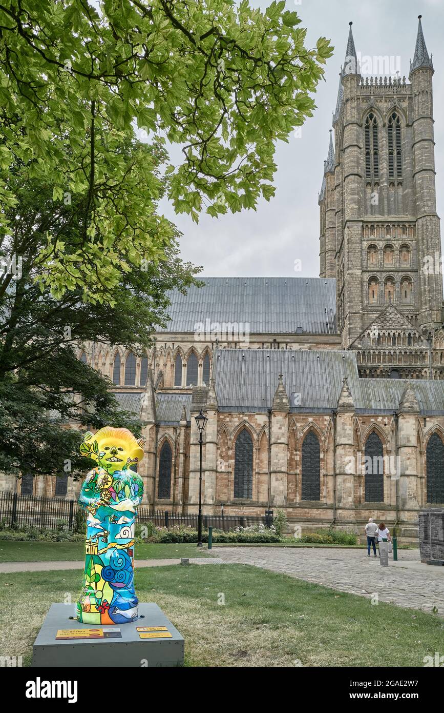A colorful Lincoln imp trail statue outside the cathedral at Lincoln ...
