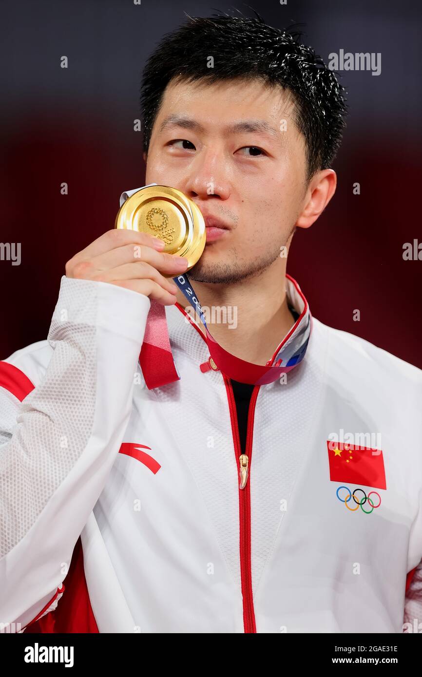 Tokyo, Japan. 30th July, 2021. Ma Long kisses his Gold medal during the ...