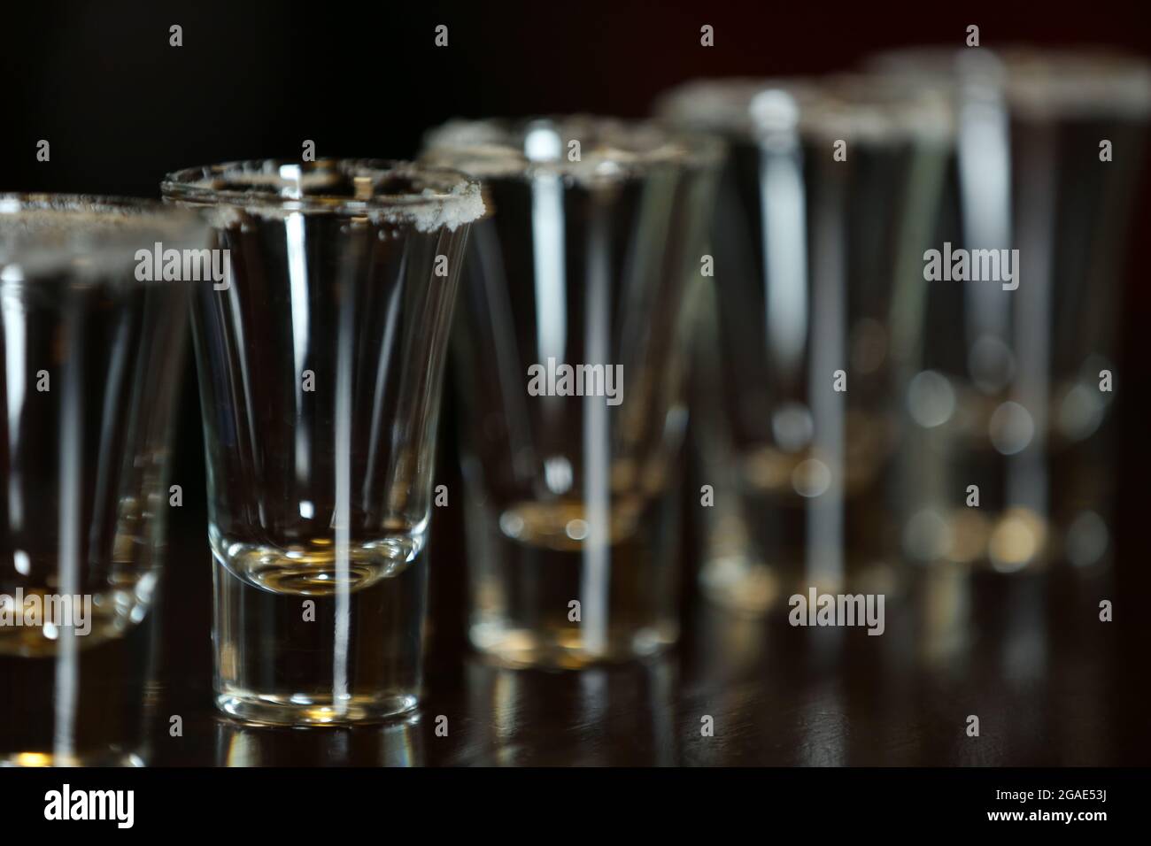 Empty shot glasses on bar counter Stock Photo - Alamy