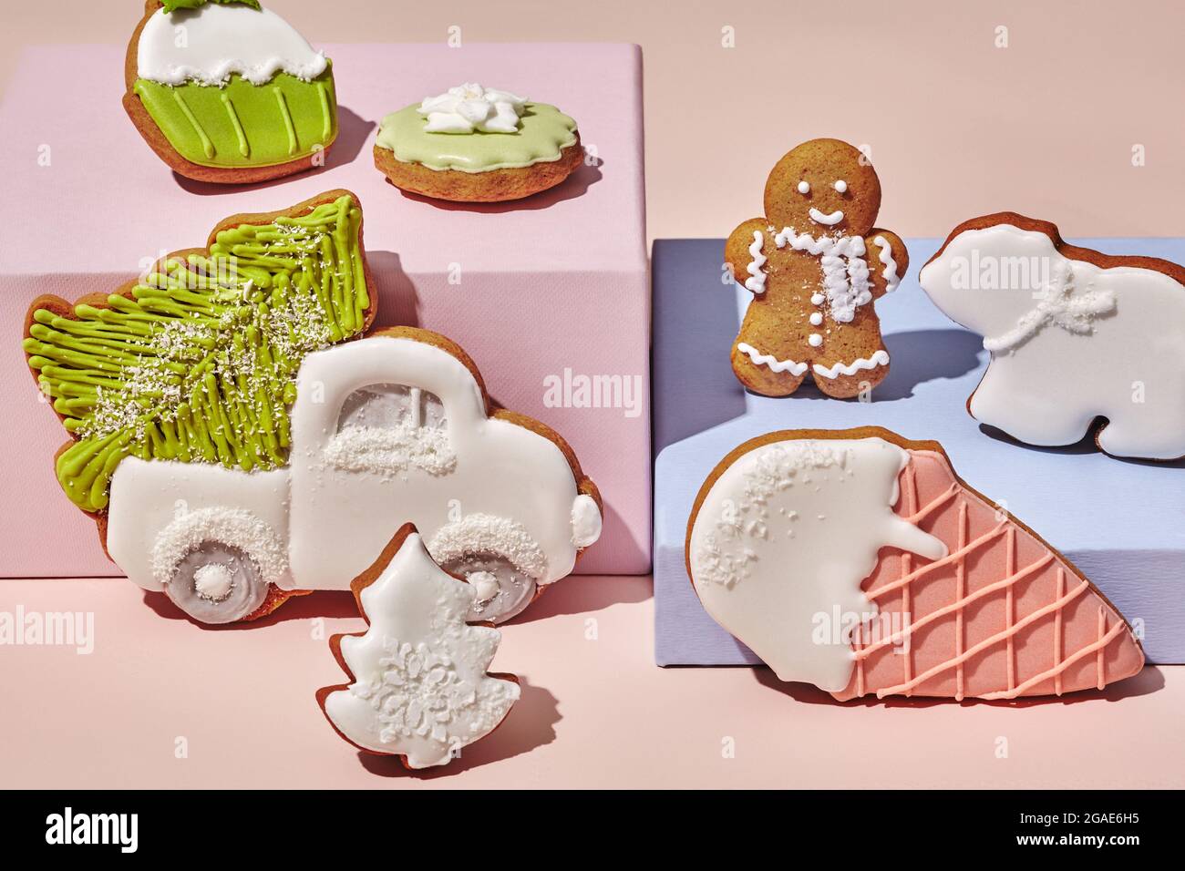 Gingerbread cookies on pink and blue pastel background Stock Photo - Alamy