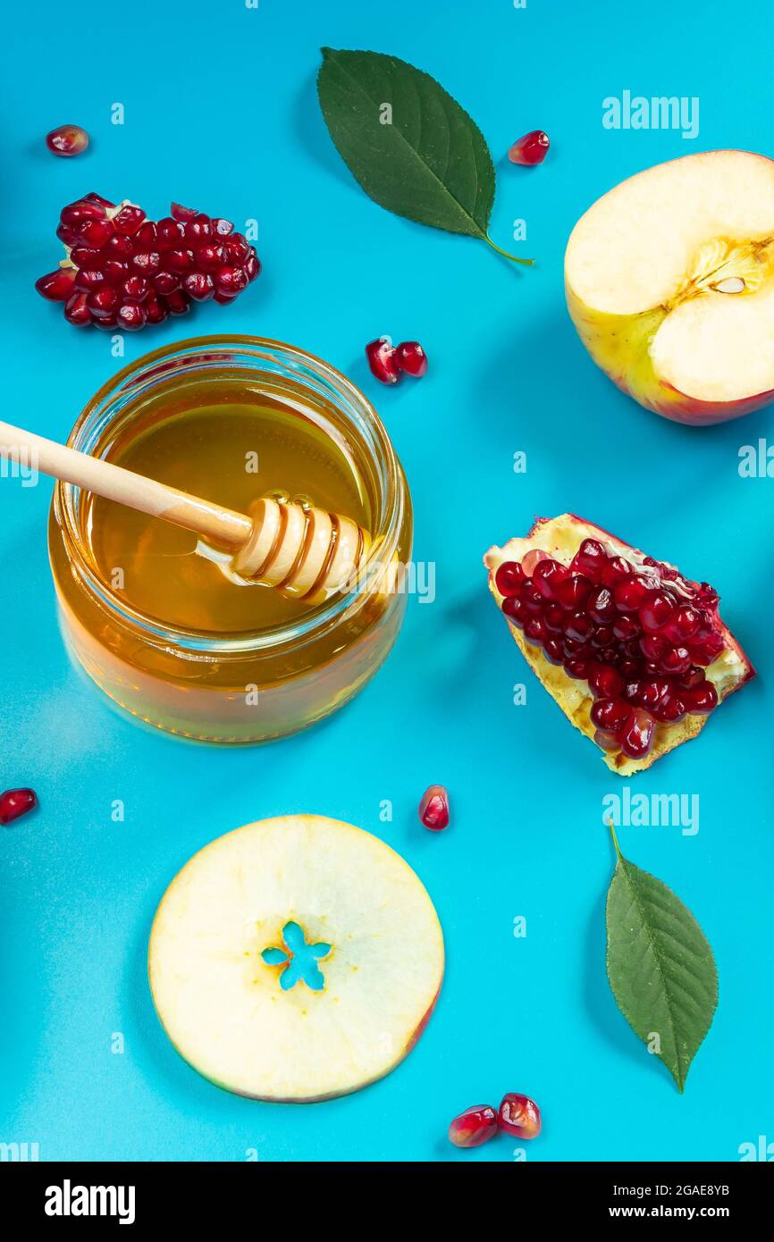 Happy Rosh Hashanah. Pattern from apples, honey and pomegranates on a ...