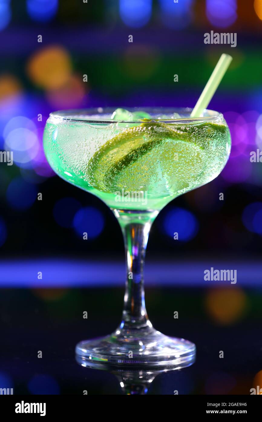 Glass of cocktail on bar background Stock Photo - Alamy