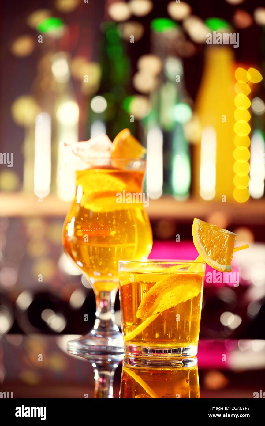 Glasses of cocktails on bar background Stock Photo - Alamy