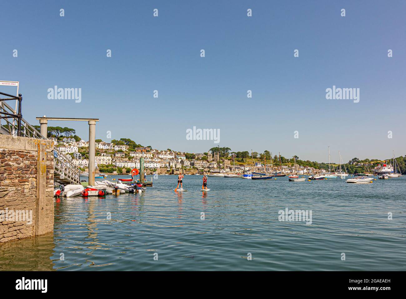 Looking over to Fowey from the quayside of Polruan on a warm summer's ...