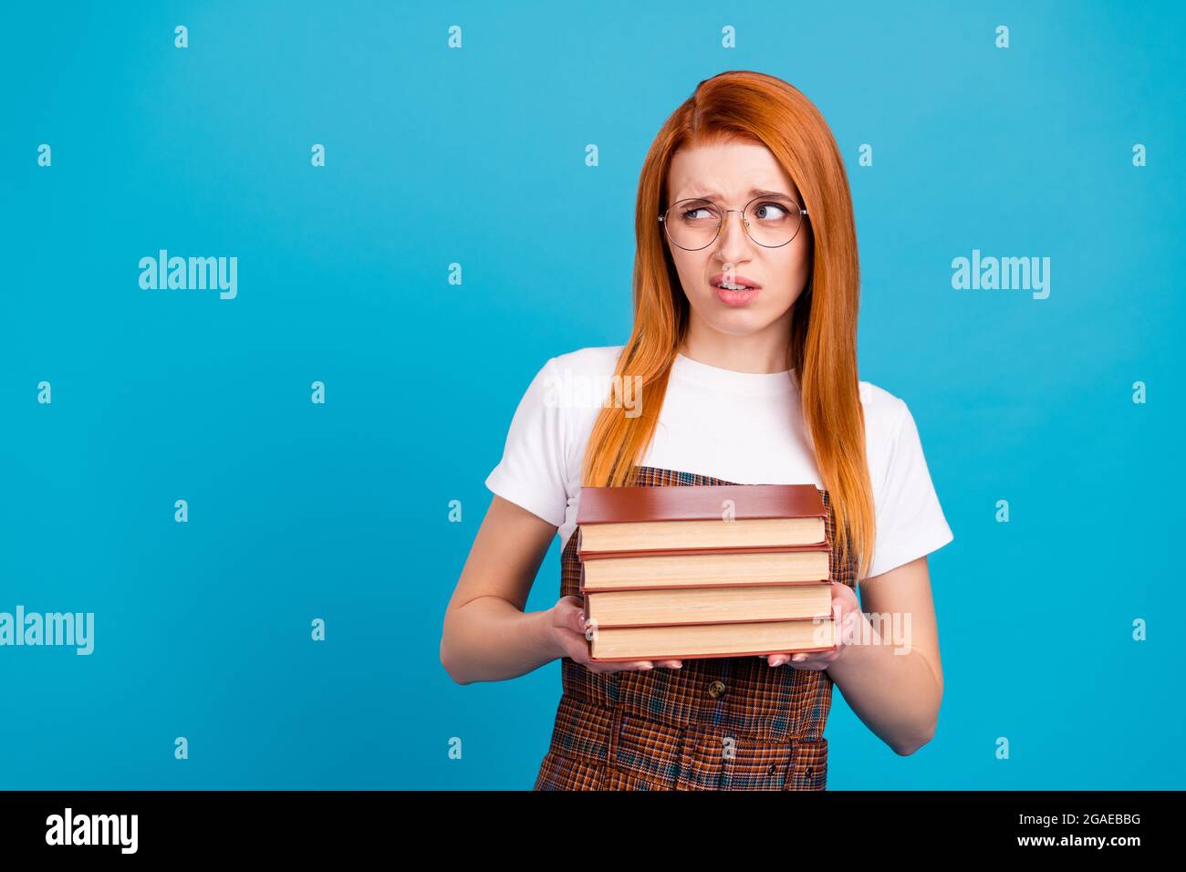 Photo of doubtful distrustful woman dressed checkered dress glasses ...