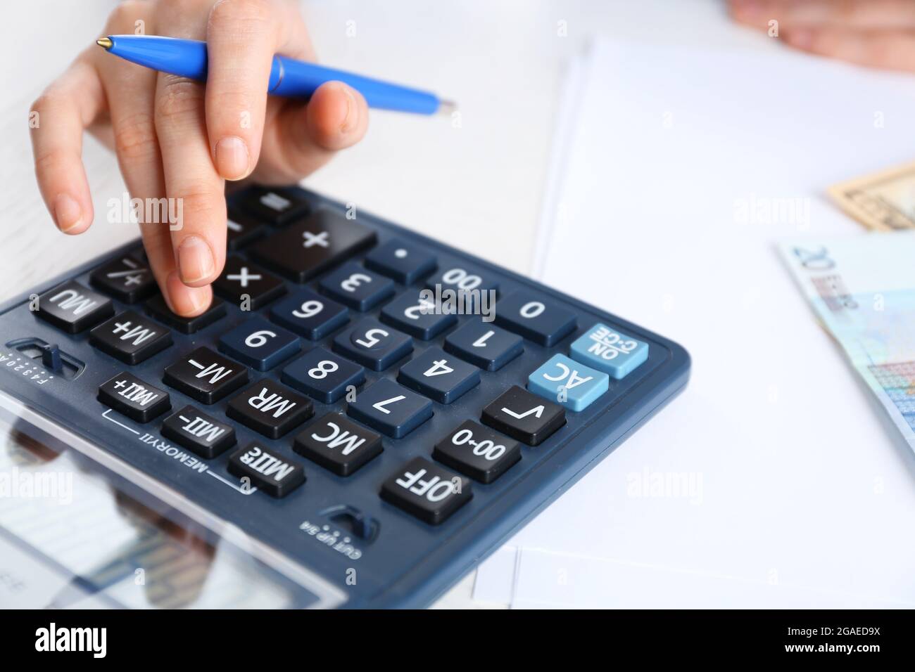 Accounting concept.Analyzing finance report with calculator Stock Photo ...