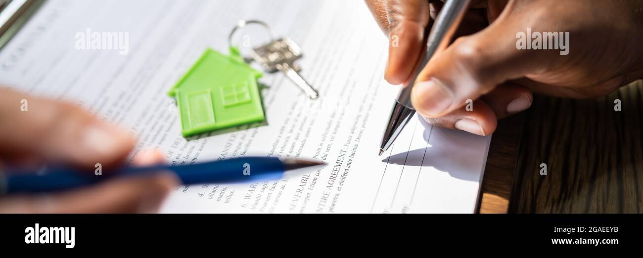 Signing Property Contract Paper. Real Estate Broker Stock Photo - Alamy