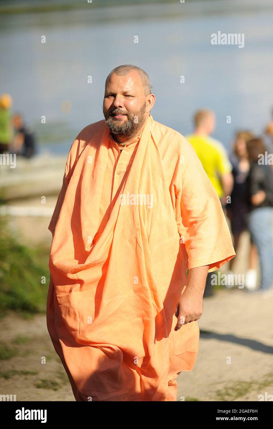 Portrait of the regular Hare Krishna huru dressed in a yellow monk robe ...