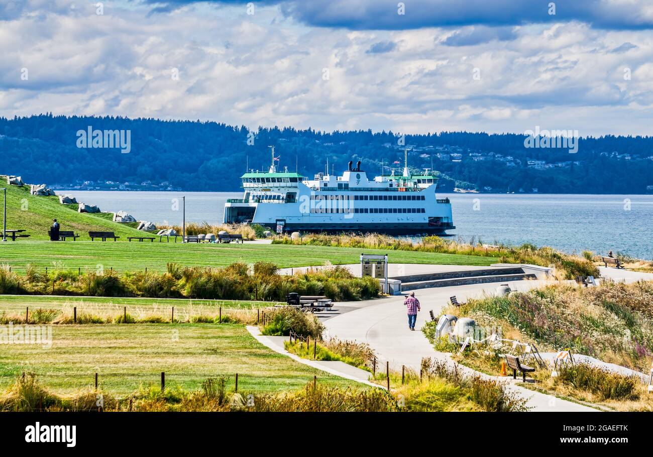A ferry leaves port near Dune Peninsula Park in Ruston, Washington ...