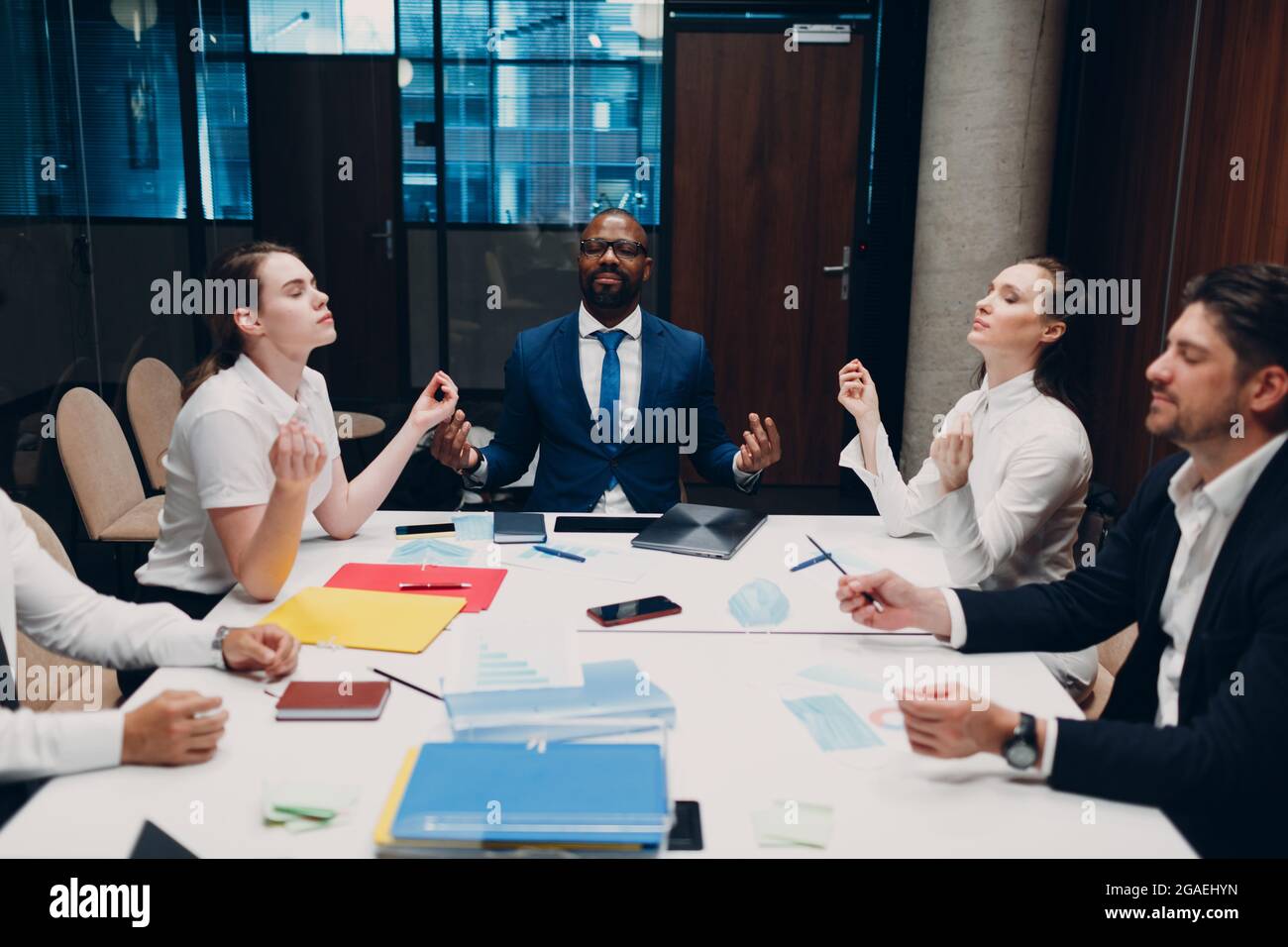 Office hands together meditate hi-res stock photography and images - Alamy