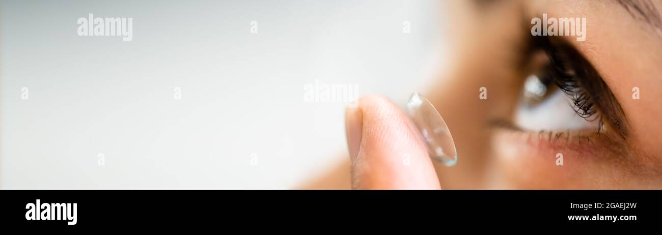 Inserting Contact Lens In Eye. Ophthalmology Eyewear Stock Photo - Alamy
