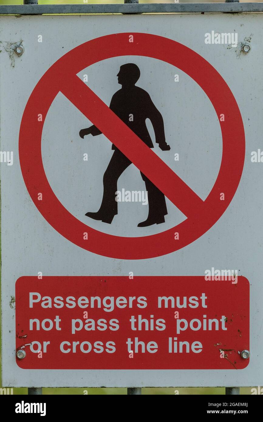 Warning sign to pedestrians not to pass this point on the platform or ...
