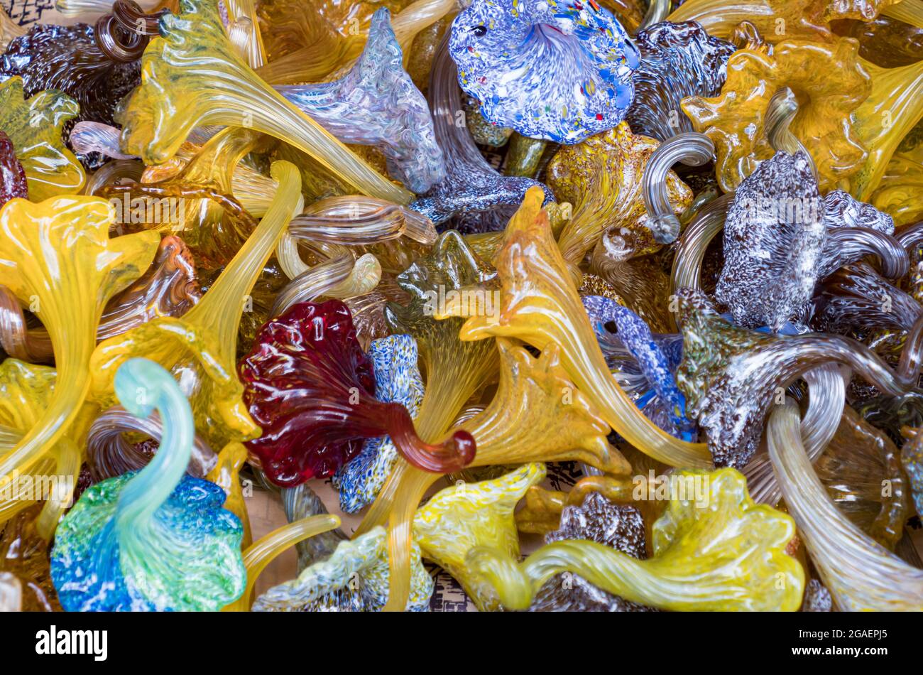 Texture, background. Many small various blown glass objects with ...