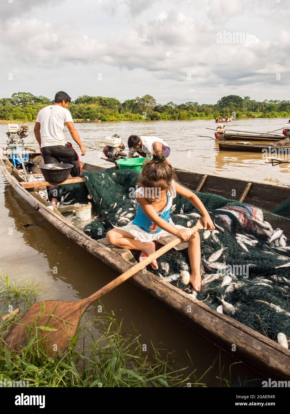 Amazon river, Peru- December 11, 2017: Small peruvian girl is sitting ...