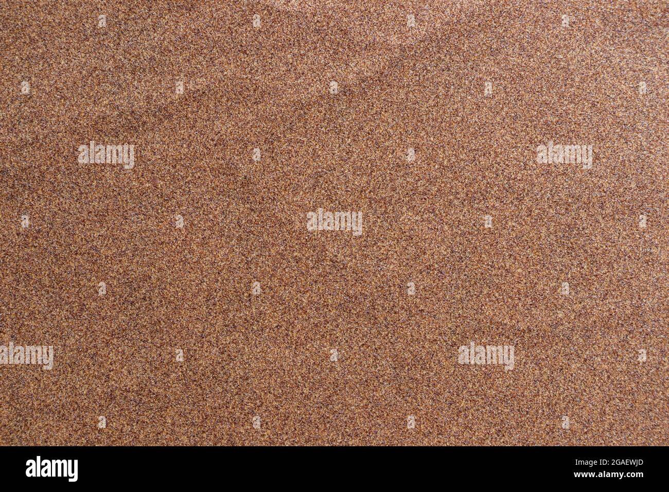 Sandpaper texture background where you can see the red-brown sand grain ...