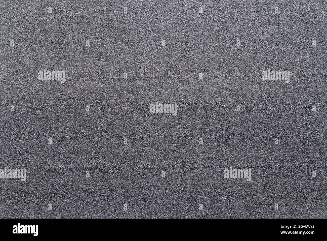 Sandpaper texture background gives a beautiful pattern of black sand ...