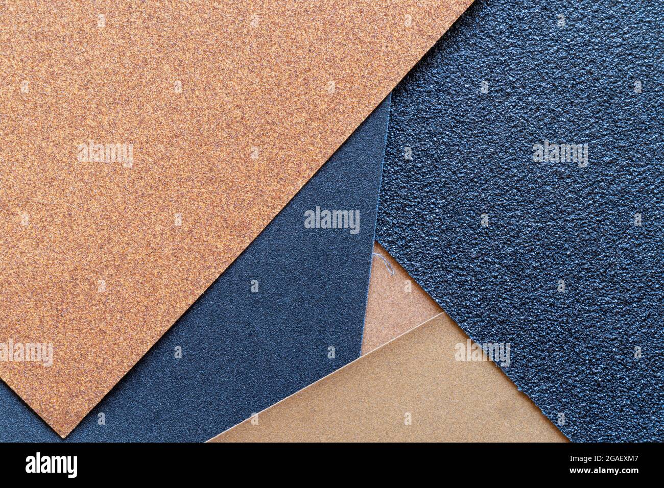 The background of the sandpaper surface, where the grains of sand on ...