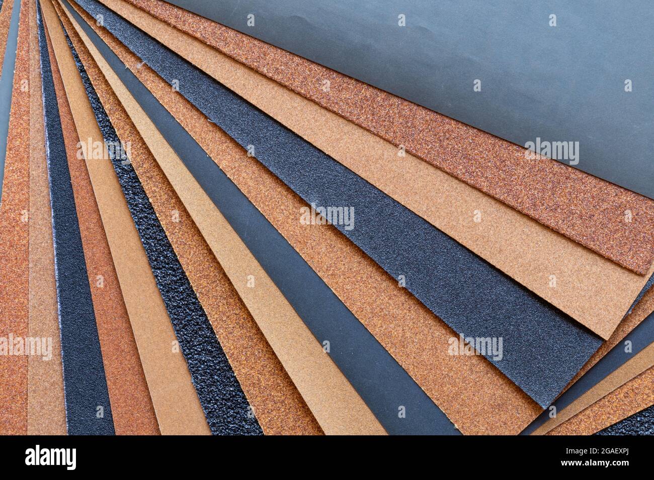 The background of the sandpaper surface, where the grains of sand on ...