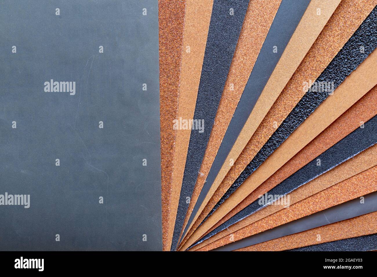 The background of the sandpaper surface, where the grains of sand on ...