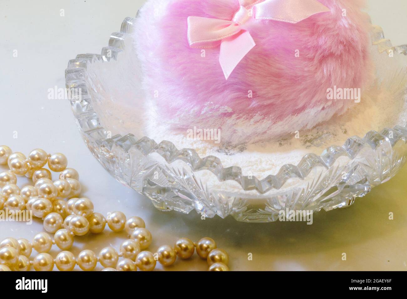 Close up of woman's vanity including talcum powder with puff in a cut ...