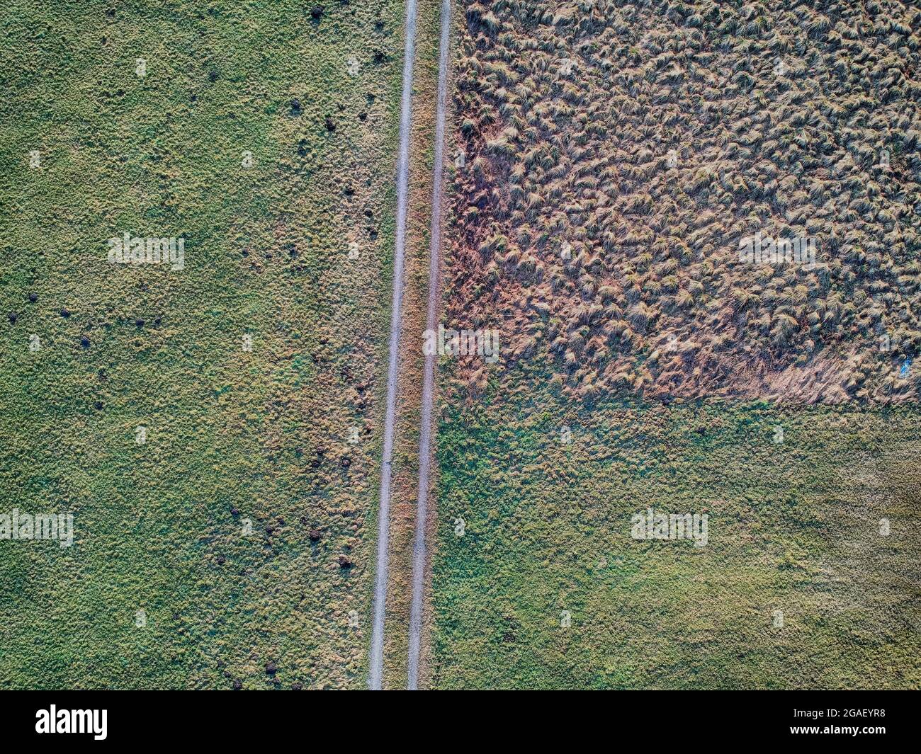 aerial landscape with path and field Stock Photo - Alamy