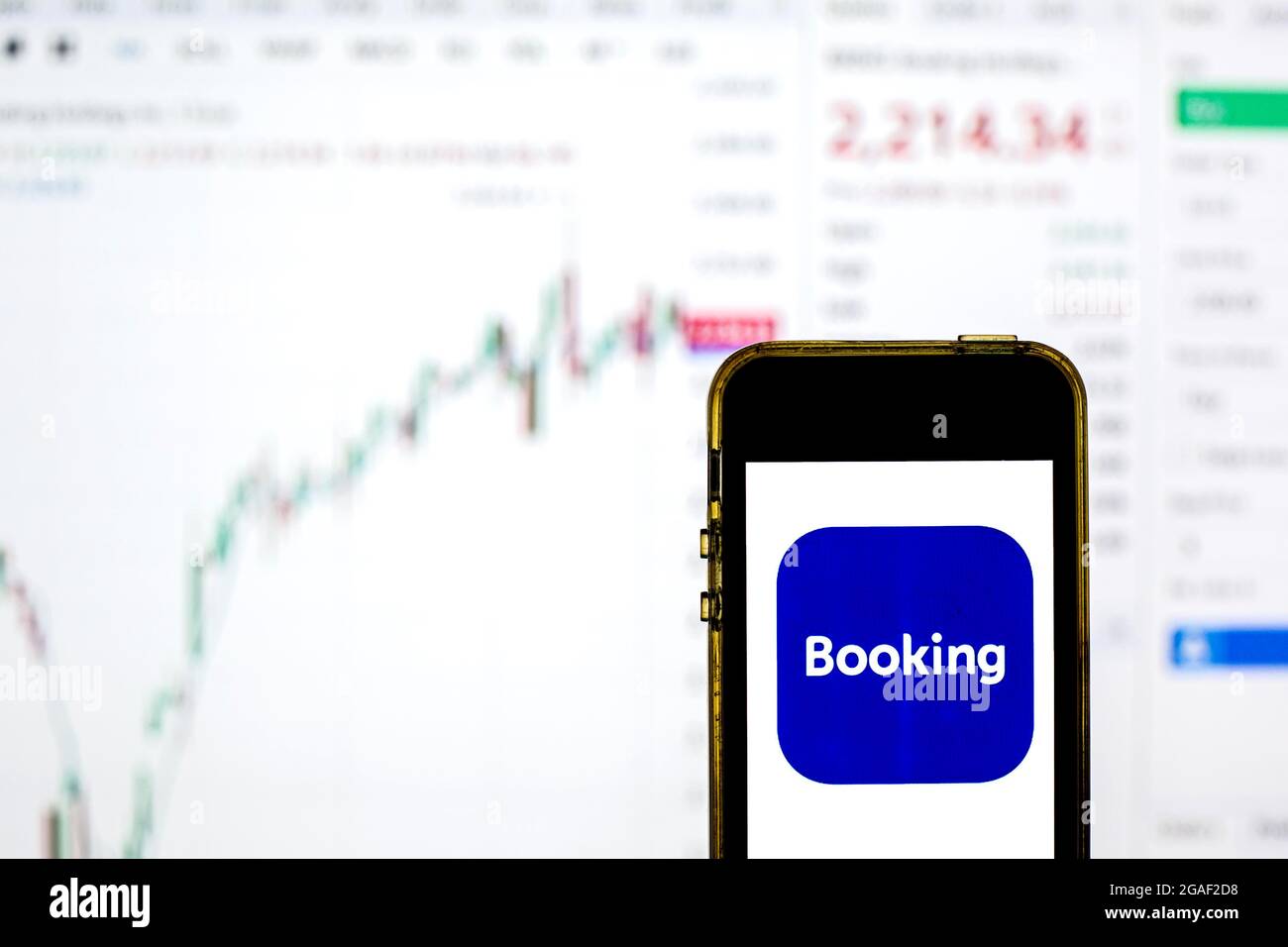 In this photo illustration a Booking.com logo seen displayed on a ...
