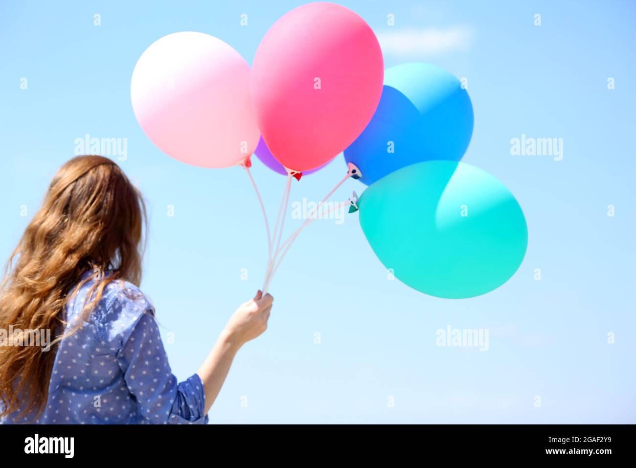 Girl with colorful balloons Stock Photo - Alamy