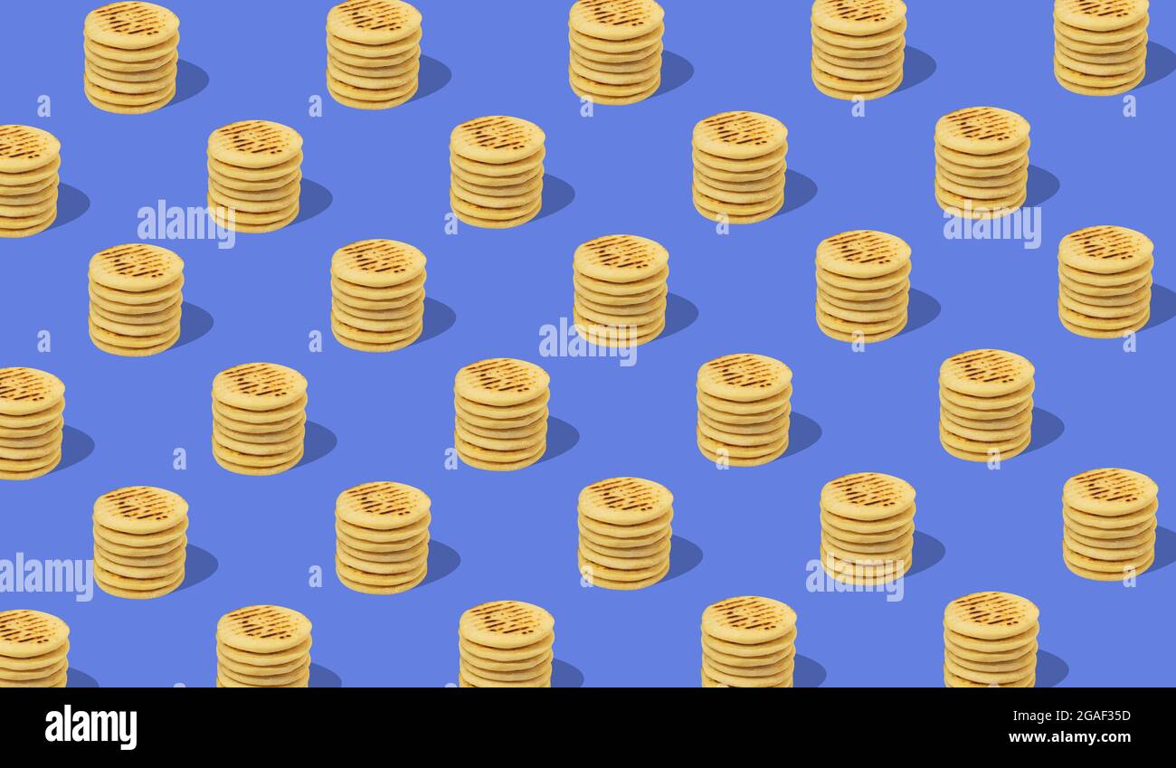 Pattern with Venezuela food arepa made from cornmeal on a blue ...