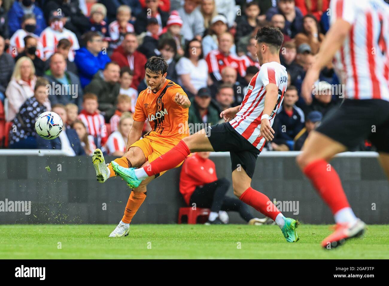 Ryan Longman #16 of Hull City crosses the ball into the box Stock Photo ...