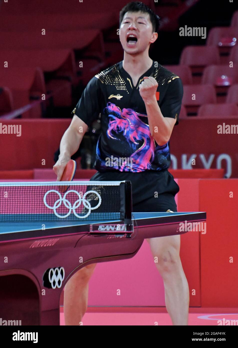 Tokyo, Japan. 30th July, 2021. China's Ma Long shouts out when marking ...